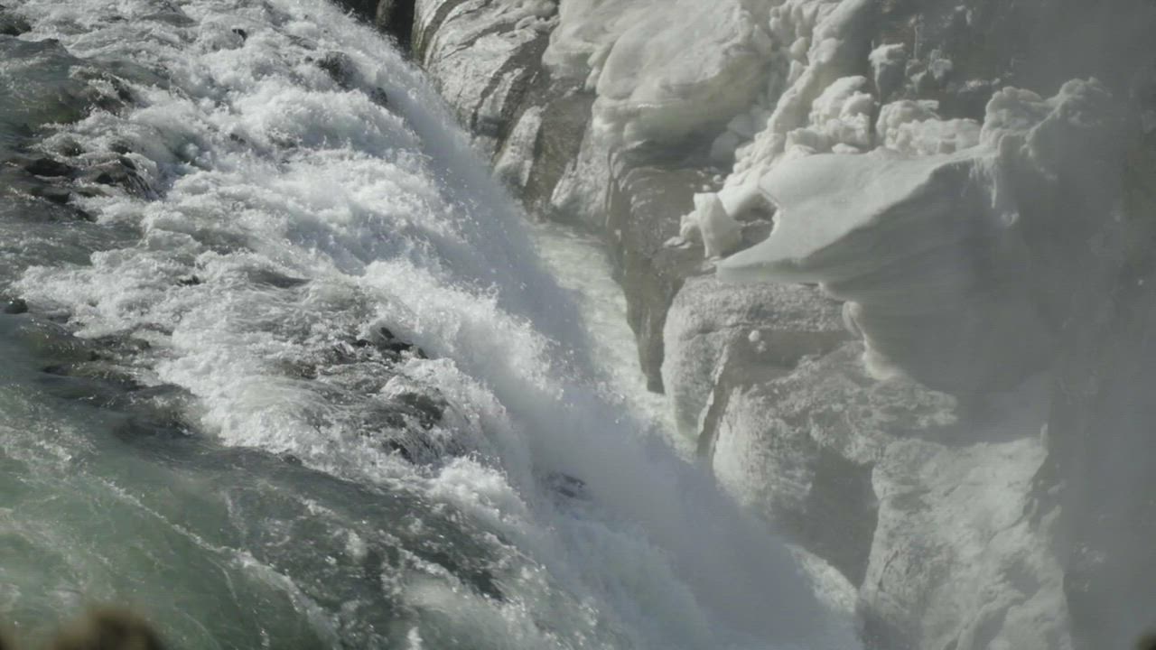 Waterfall breaking over the edge - Free Stock Video