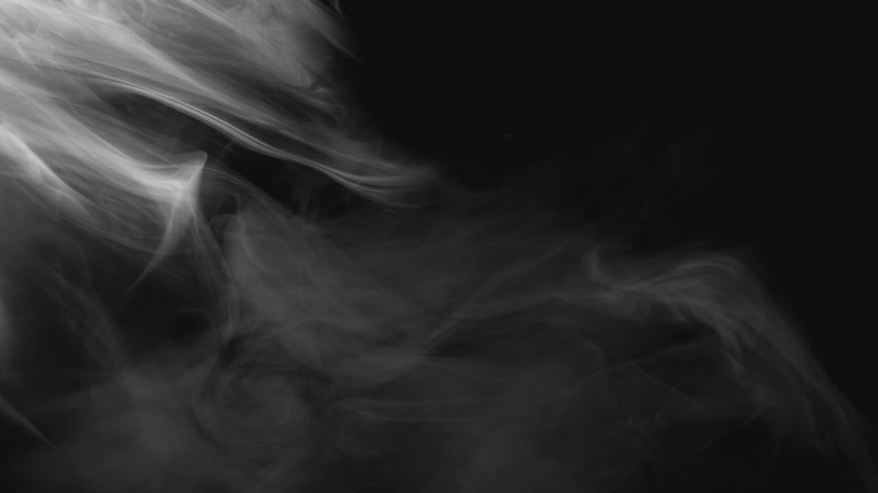 Drafting smoke across a dark screen - Free Stock Video