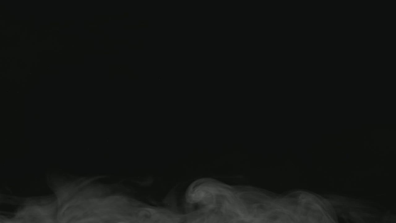 Smoke floating in the dark - Free Stock Video