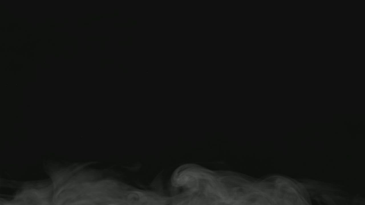 Smoke rising in a dark room - Free Stock Video