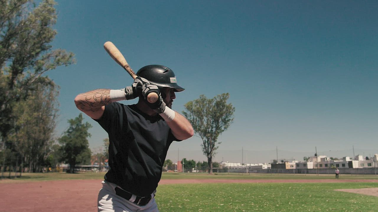 Batter hits a baseball - Free Stock Video