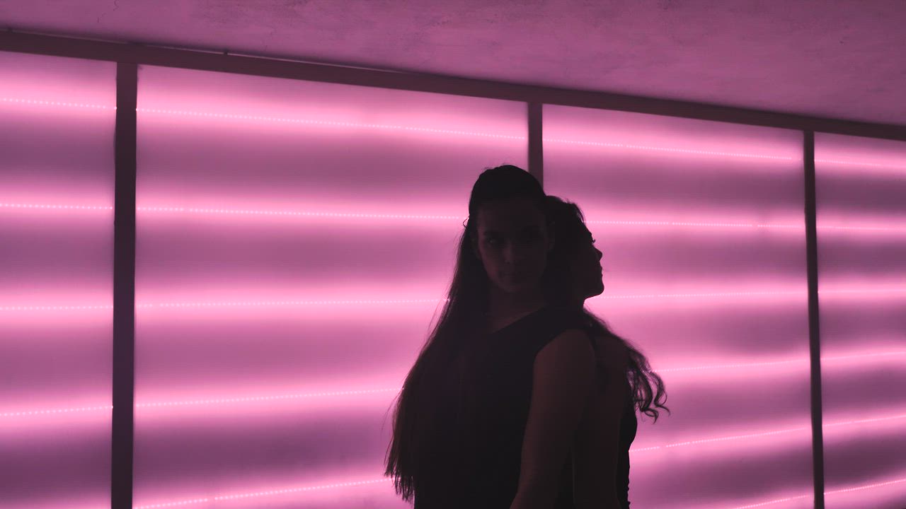 Contemporary dancers in neon-lit dance studio - Free Stock Video