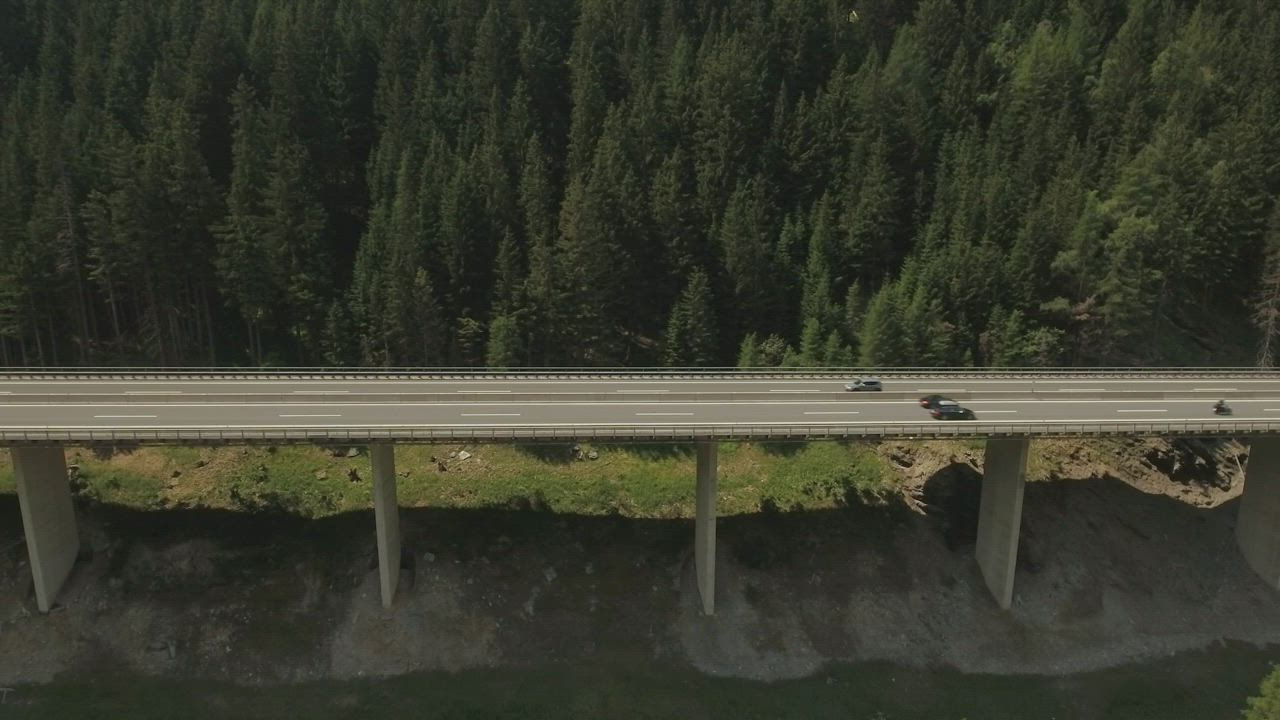 Vehicle bridge in a mountain area - Free Stock Video