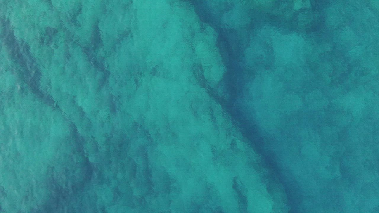 Relaxing turquoise water texture in the sea - Free Stock Video