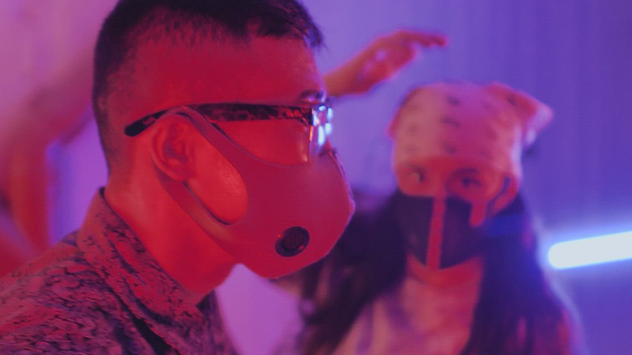 A boy and a girl with a mask dancing nearby - Free Stock Video