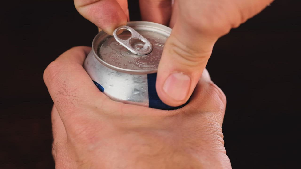 Opening a can of beer, close up view - Free Stock Video