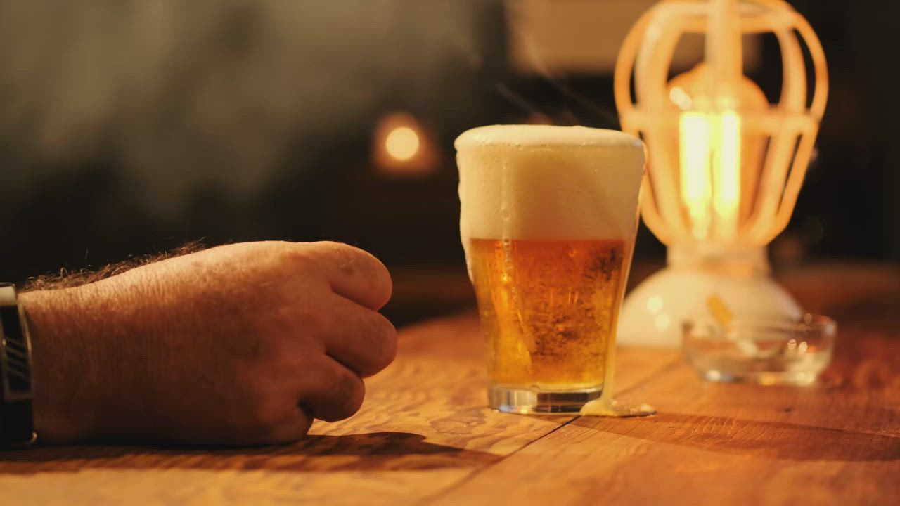 Taking a glass of beer from a bar - Free Stock Video