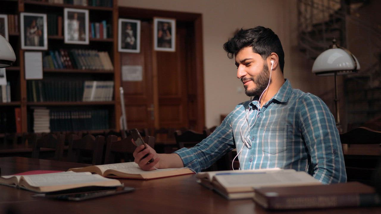 Man says hello on smartphone video call - Free Stock Video