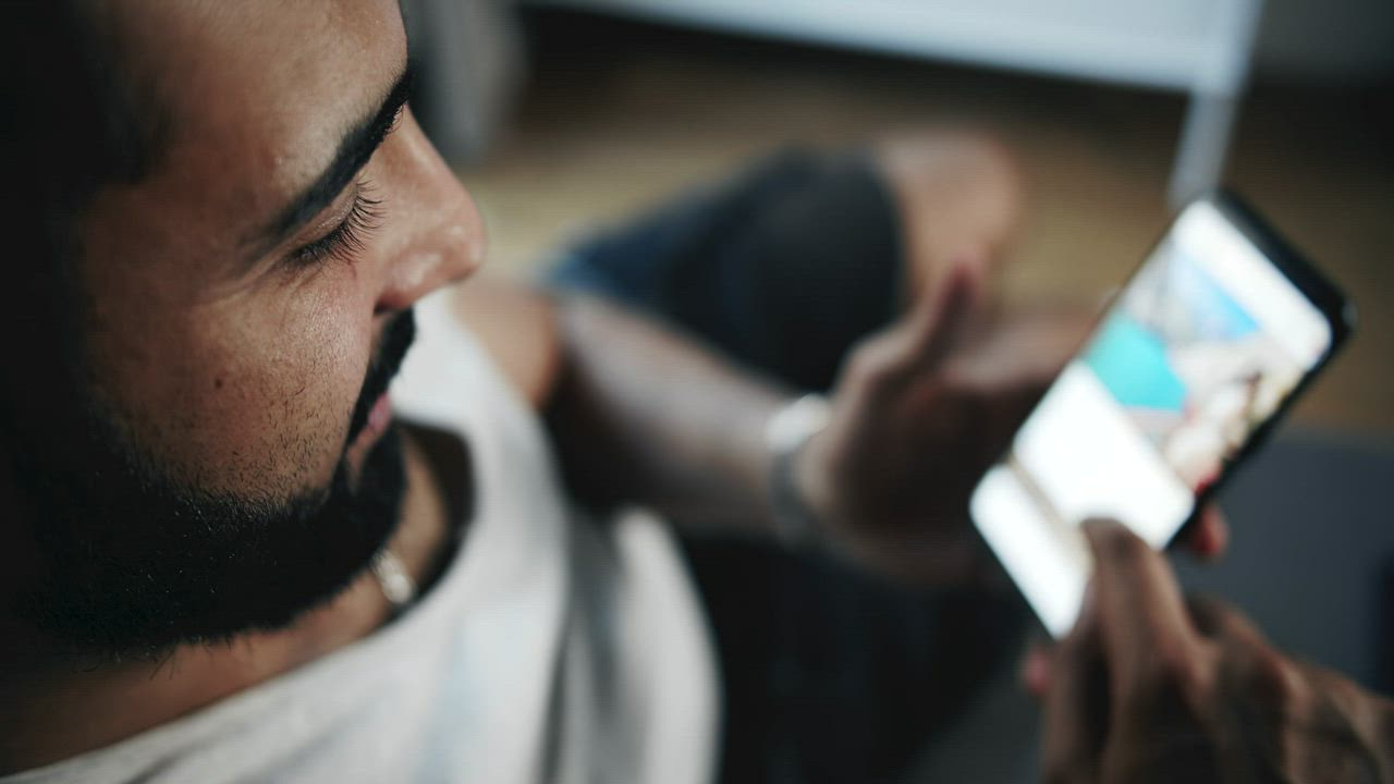 Man browsing social media on smartphone top view - Free Stock Video
