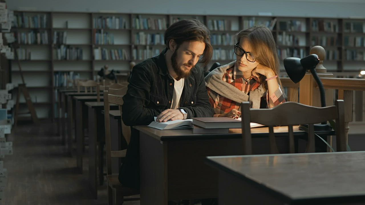 University students studying late in the library - Free Stock Video