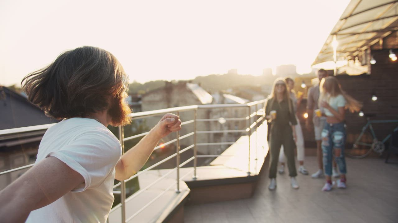 Cinematic of friends dancing on terrace party - Free Stock Video