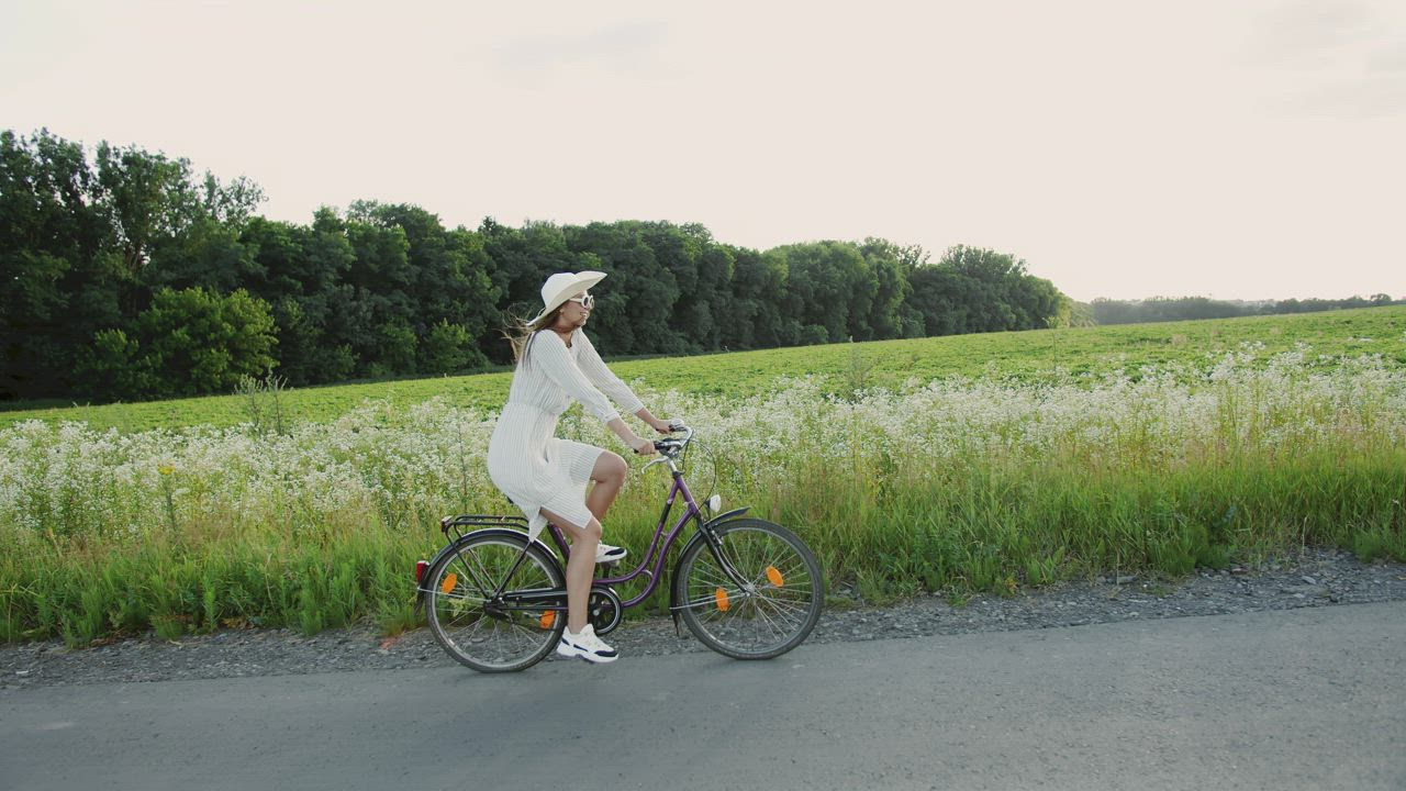 Couple on romantic bike ride in spring countryside - Free Stock Video