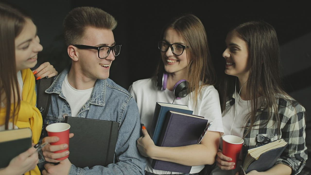 Happy smiling students promote college education - Free Stock Video