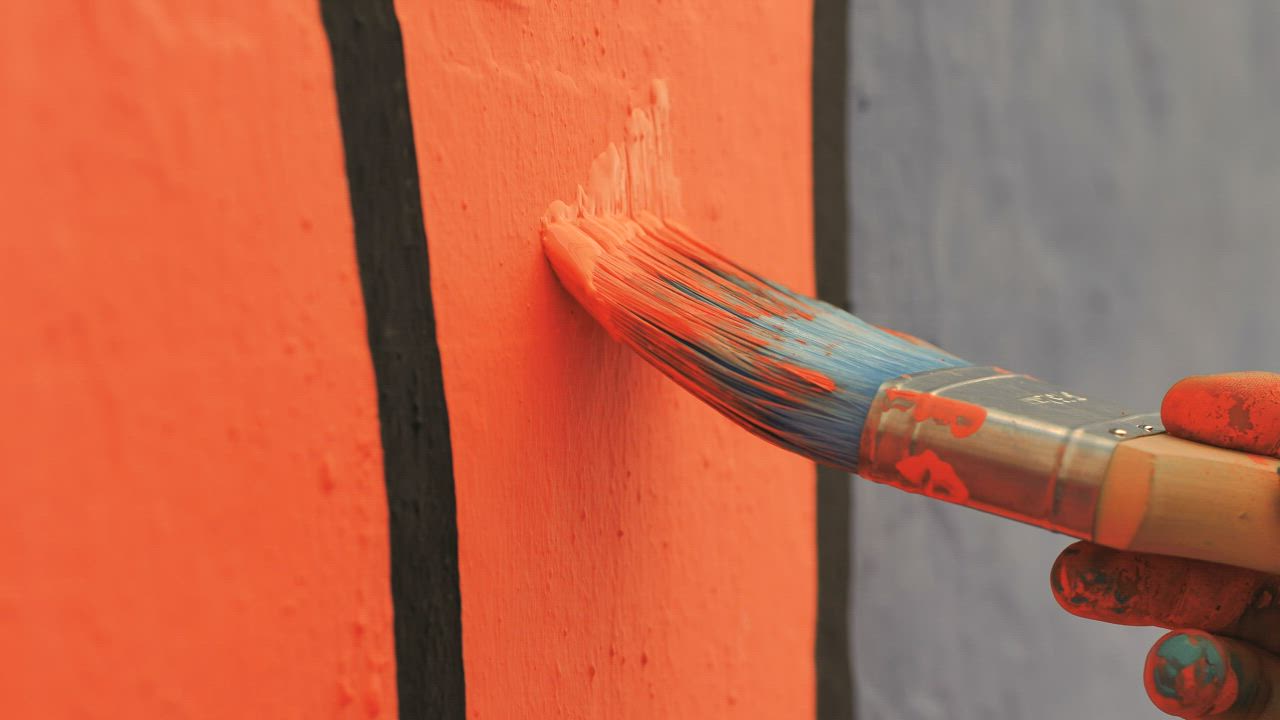 Orange paint on a mural - Free Stock Video