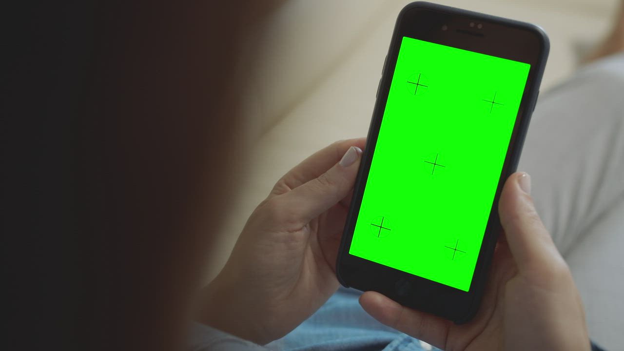 Hands hold greenscreen mobile phone - Free Stock Video