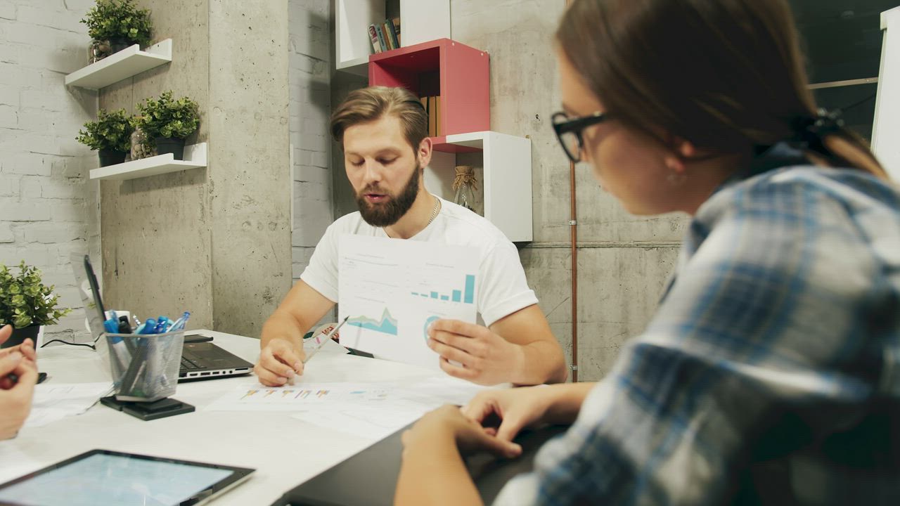 Team celebrates winning project results at meeting - Free Stock Video