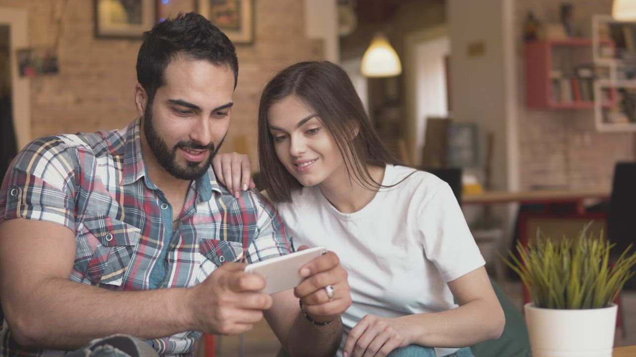 Friends enjoy mobile gaming on break - Free Stock Video