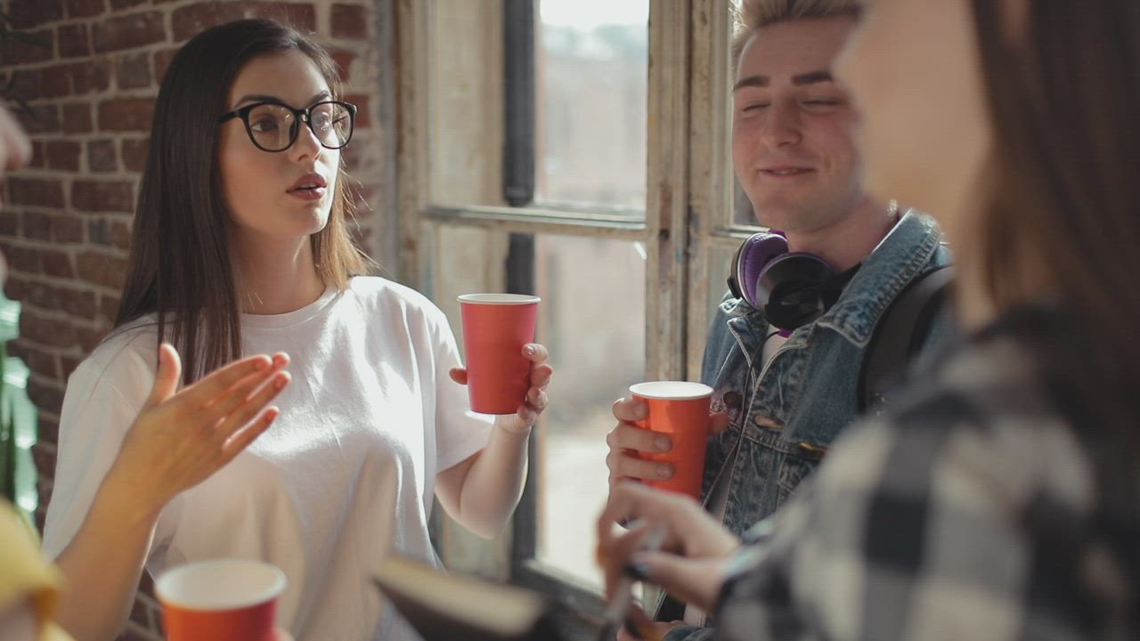 Students think and talk about ideas while drinking - Free Stock Video