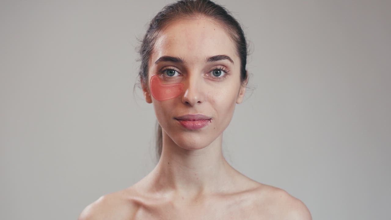 Model putting on pads for facial skin care - Free Stock Video
