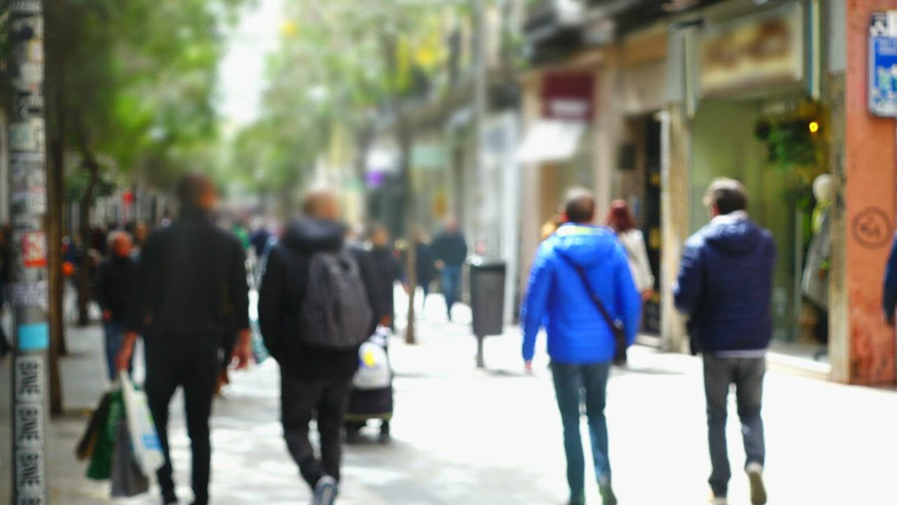 Popular street with pedestrians taking a walk - Free Stock Video