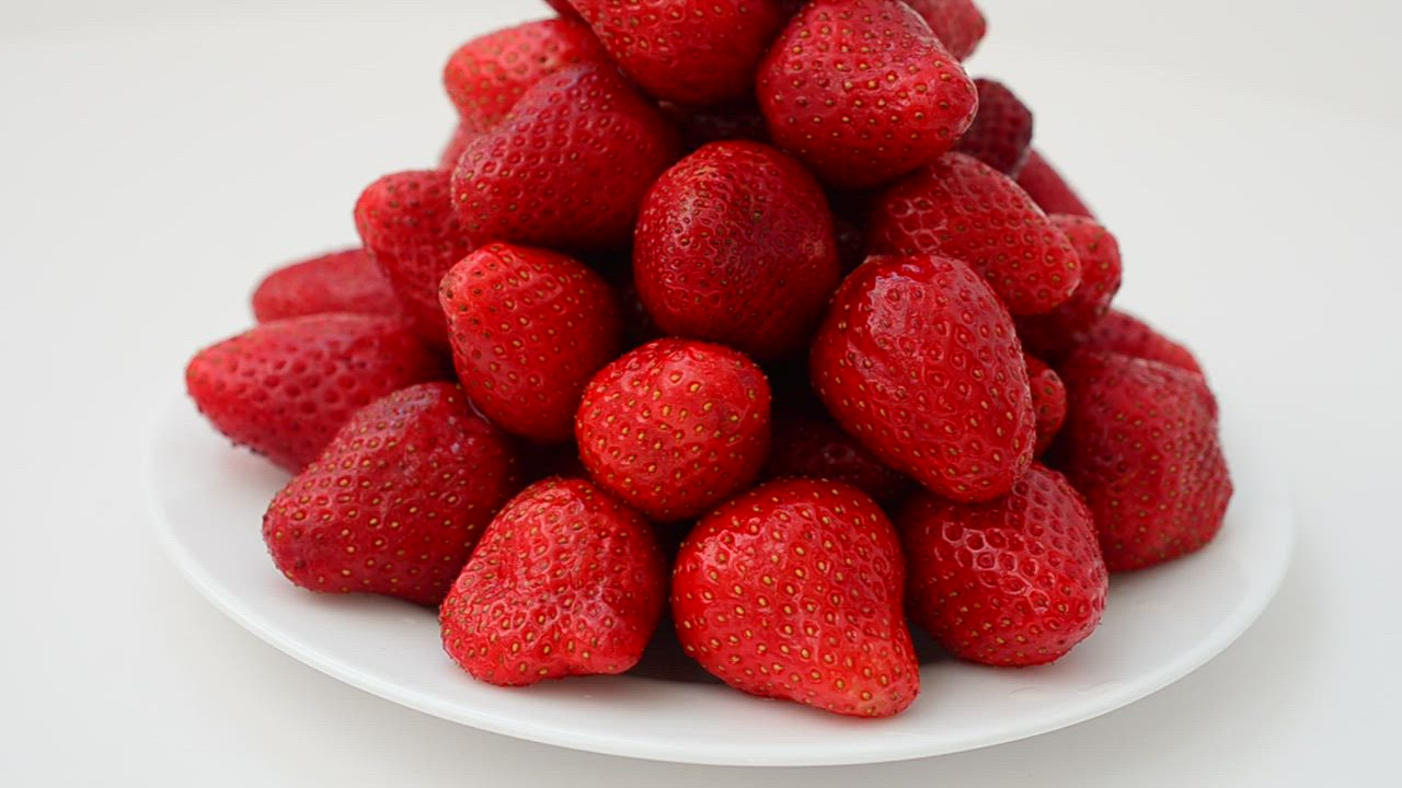 Presentation of strawberries on a spinning dish - Free Stock Video