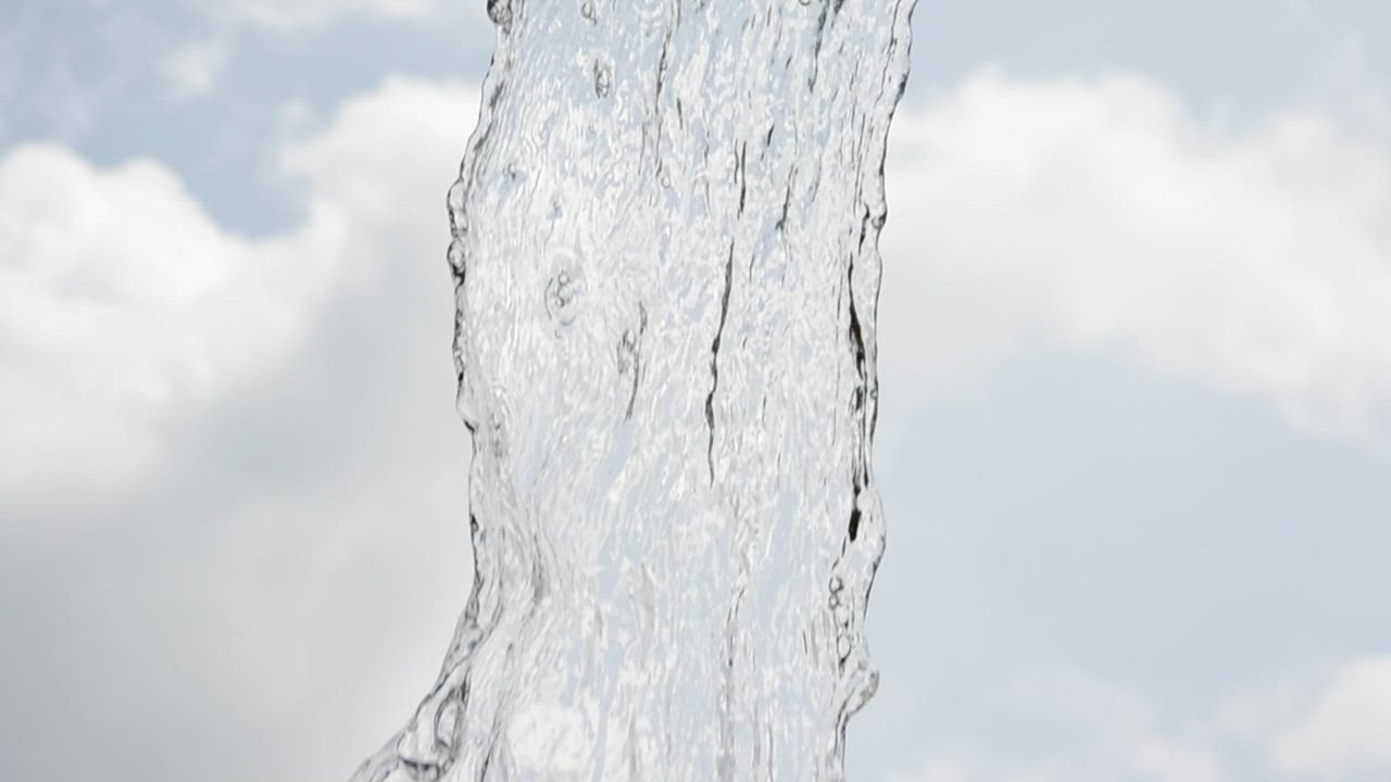 Water falling with the sky in the background - Free Stock Video