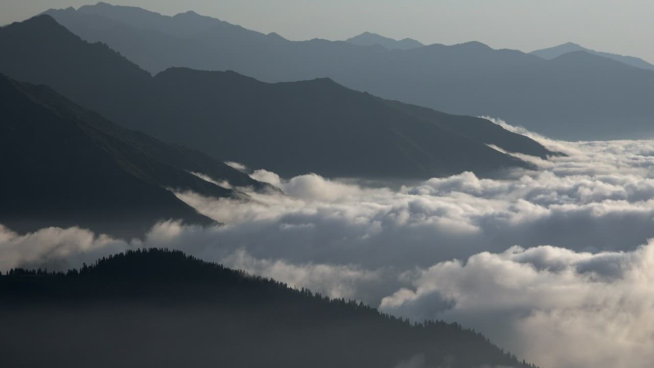 Clouds moving in the mountains - Free Stock Video