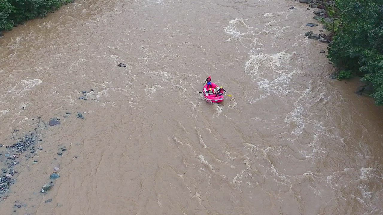 A pink boat rafting in a wild river - Free Stock Video