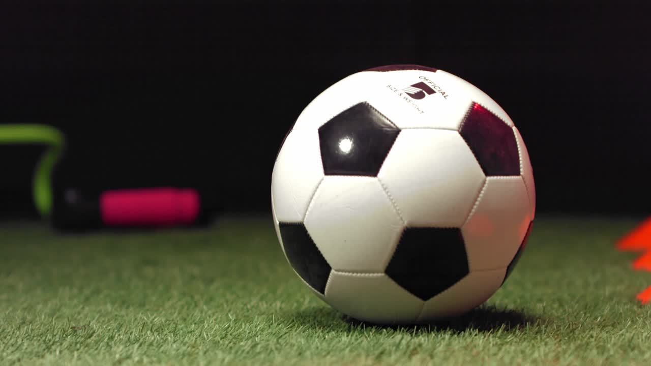 Soccer Ball Rolling Across Turf During Training - Free Stock Video