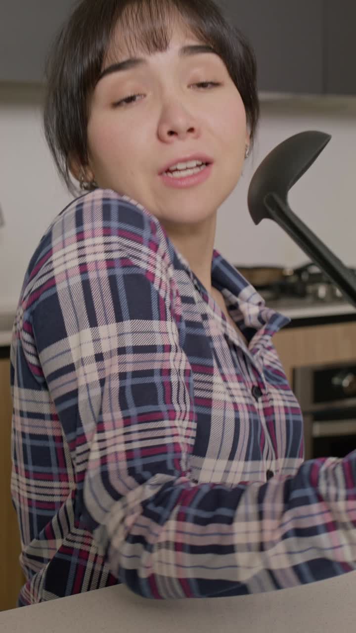 Young Woman Singing in the Kitchen - Free Stock Video