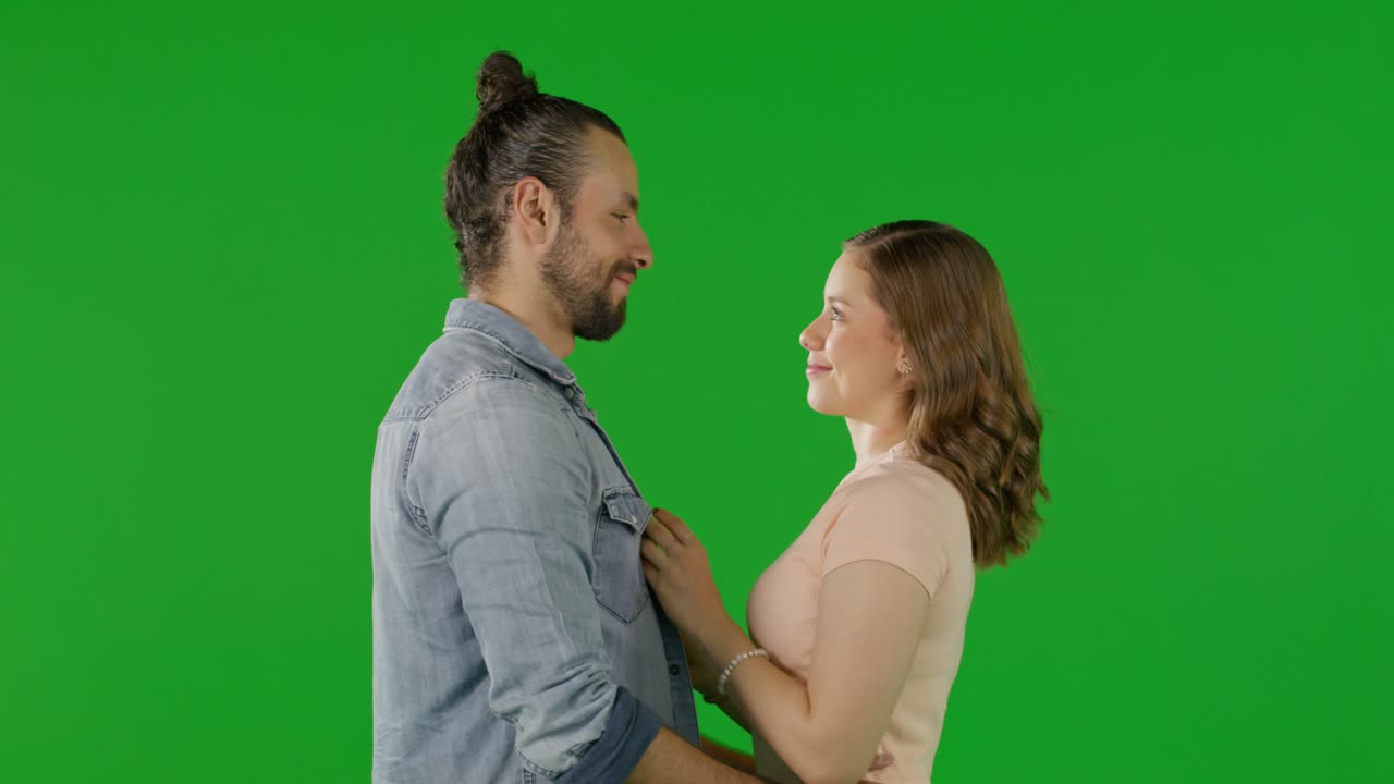 Couple embracing against green screen background - Free Stock Video