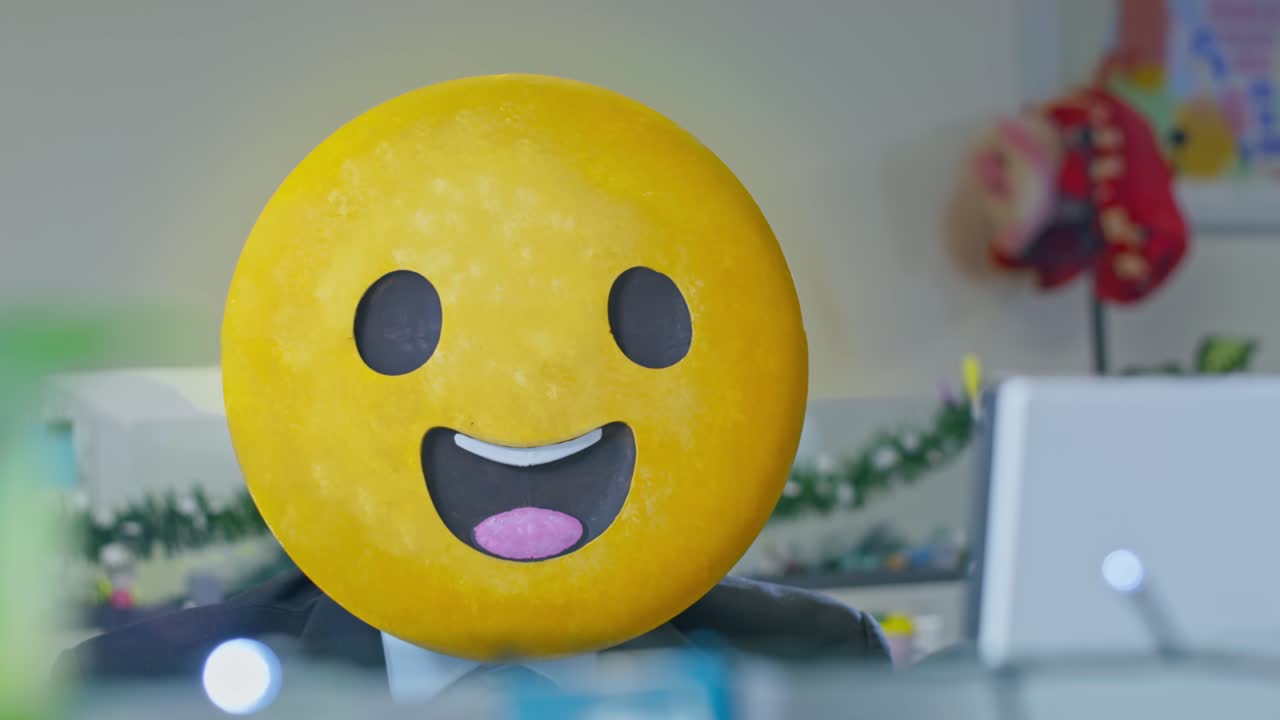 Smiley Emoji Head in Office Setting - Free Stock Video